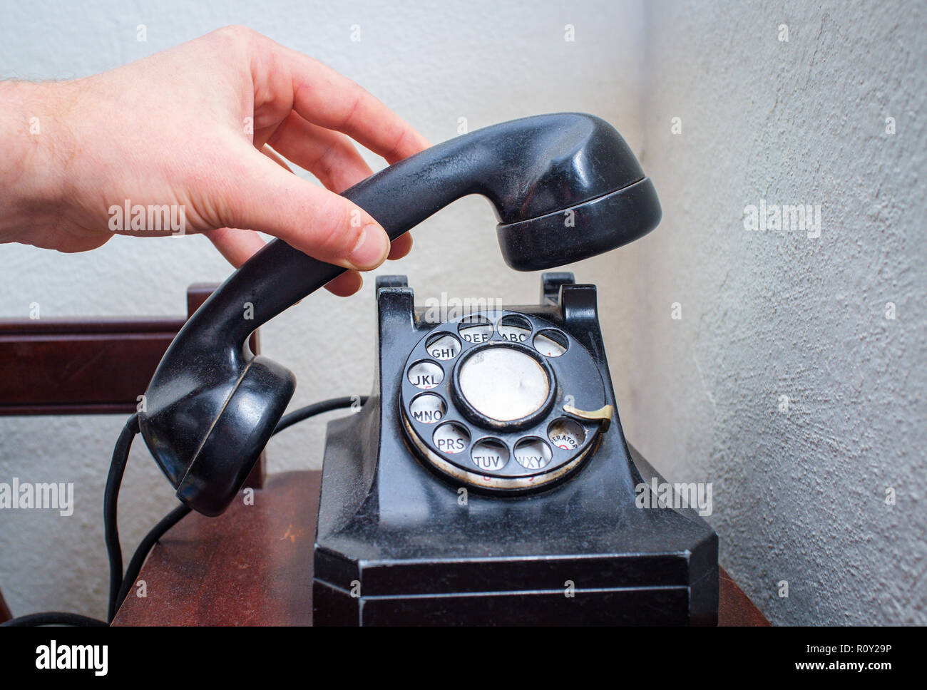Old vintage rotary dial telephone on wooden desk Stock Photo - Alamy