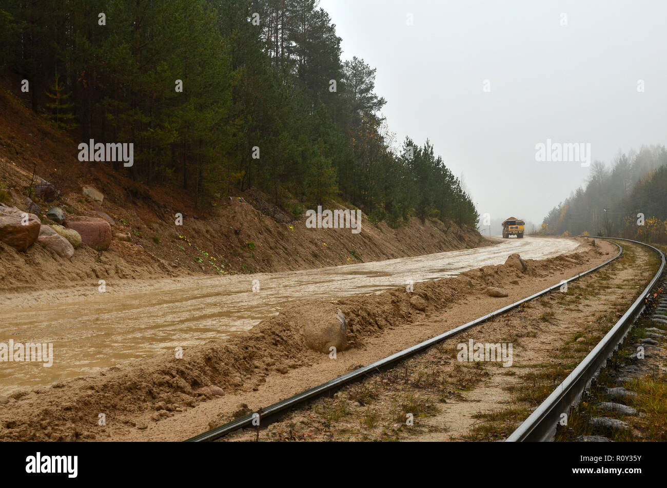 Big yellow diesel truck working in a mining quarry. Heavy mining truck ...