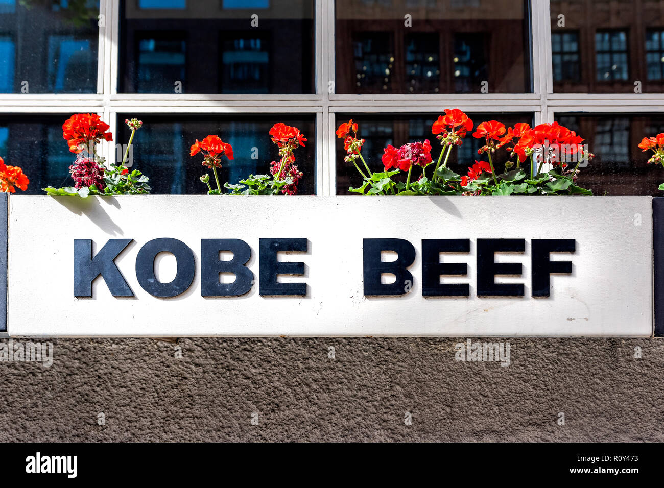 Kobe beef sign in front of Japanese restaurant with red geranium ...