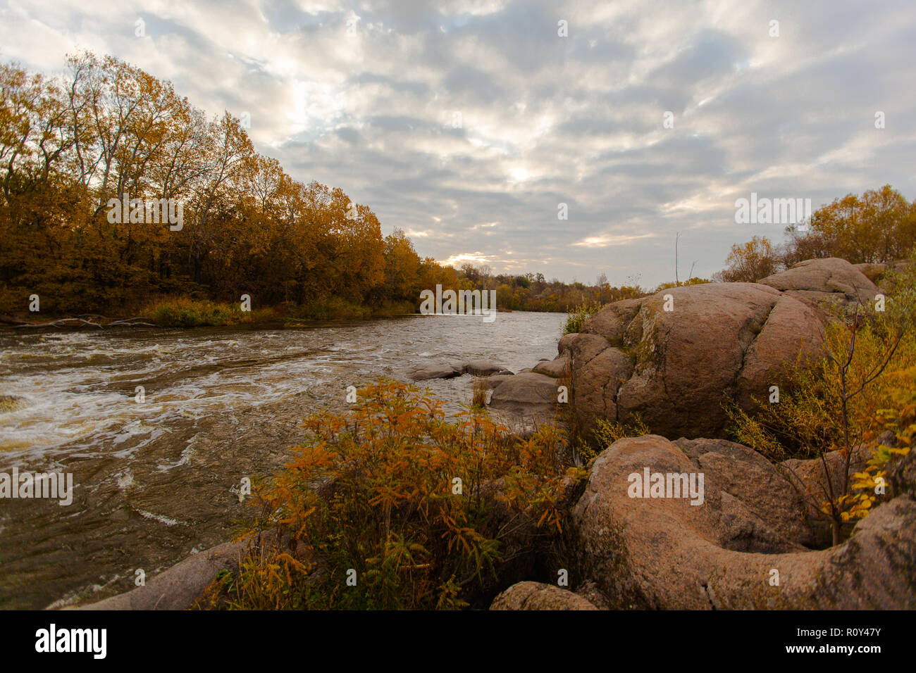 river in late autumn under a blue sky with clouds panorama in the ...