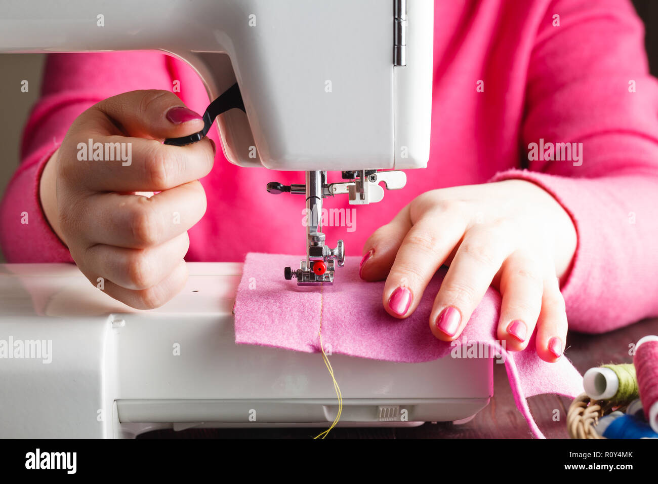 Tailor working on a sewing machine Stock Photo - Alamy