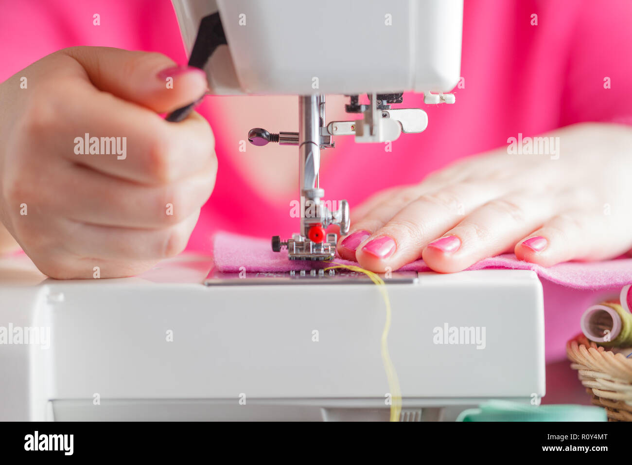 Working sewing machine pink textile hi-res stock photography and images ...