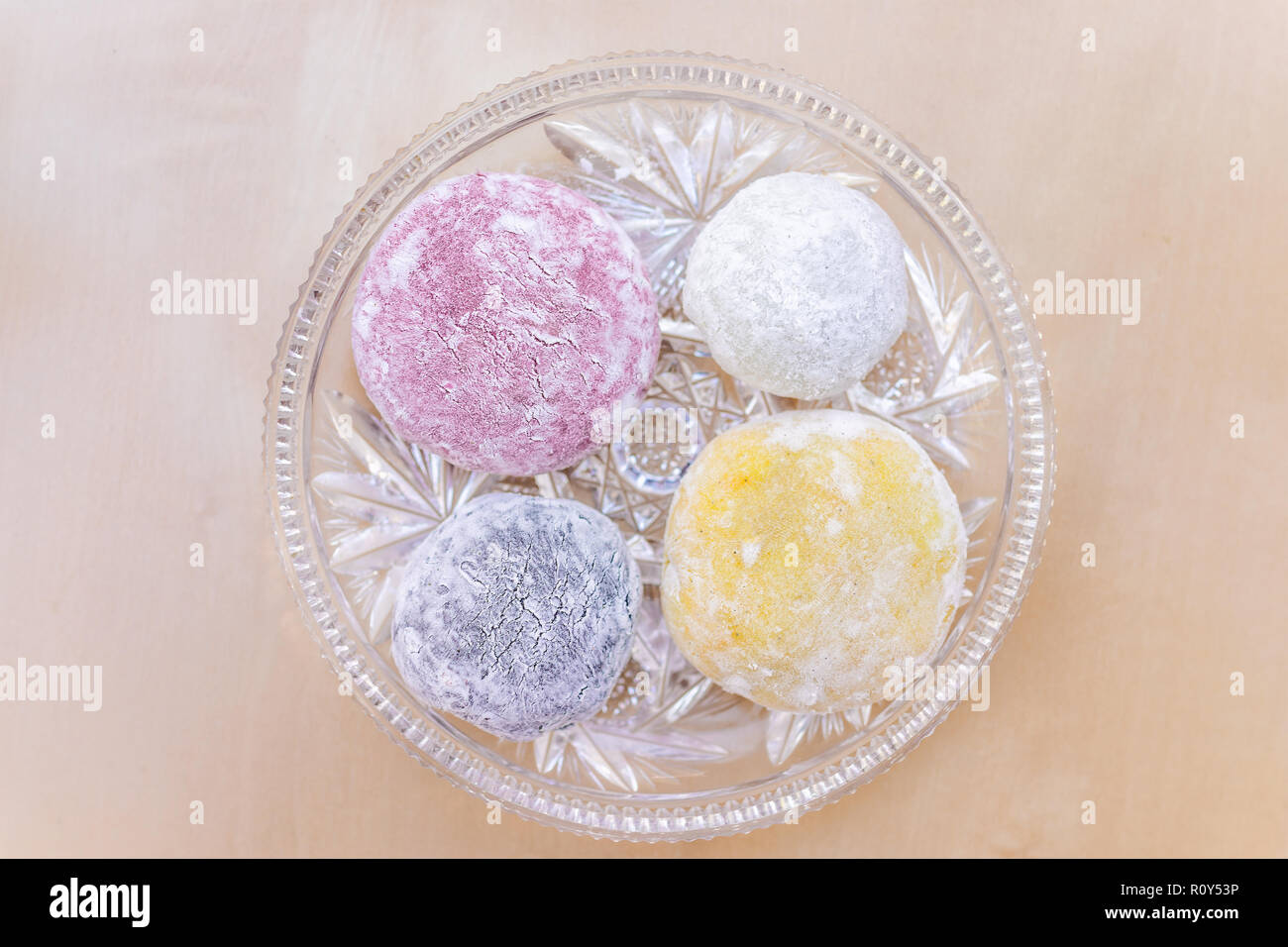 Four round whole mochi sticky glutinous rice cake dessert pieces ...