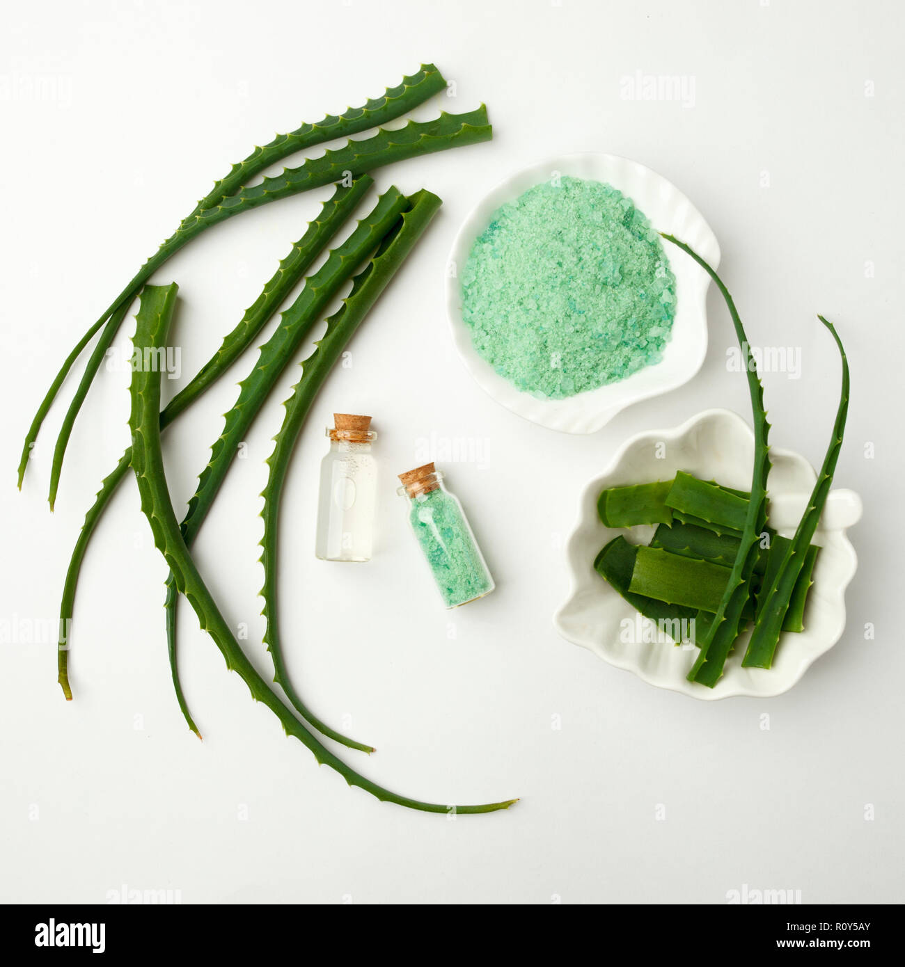 fresh aloe vera leaves, green aromatic spa salt and glass of aloe vera ...