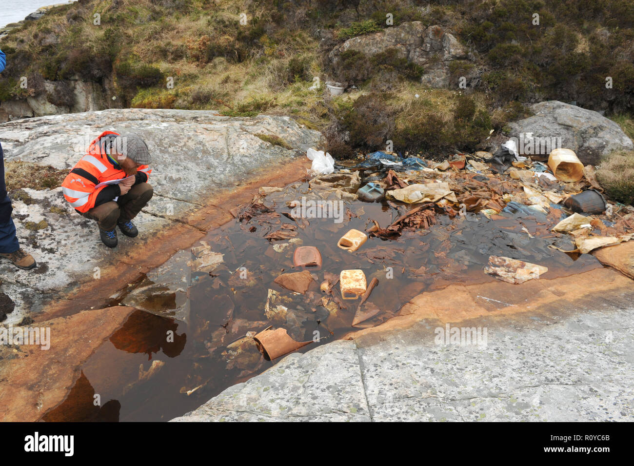 Bergen, Norway. 24th May, 2018. Eivind Bastesen examines garbage on a ...