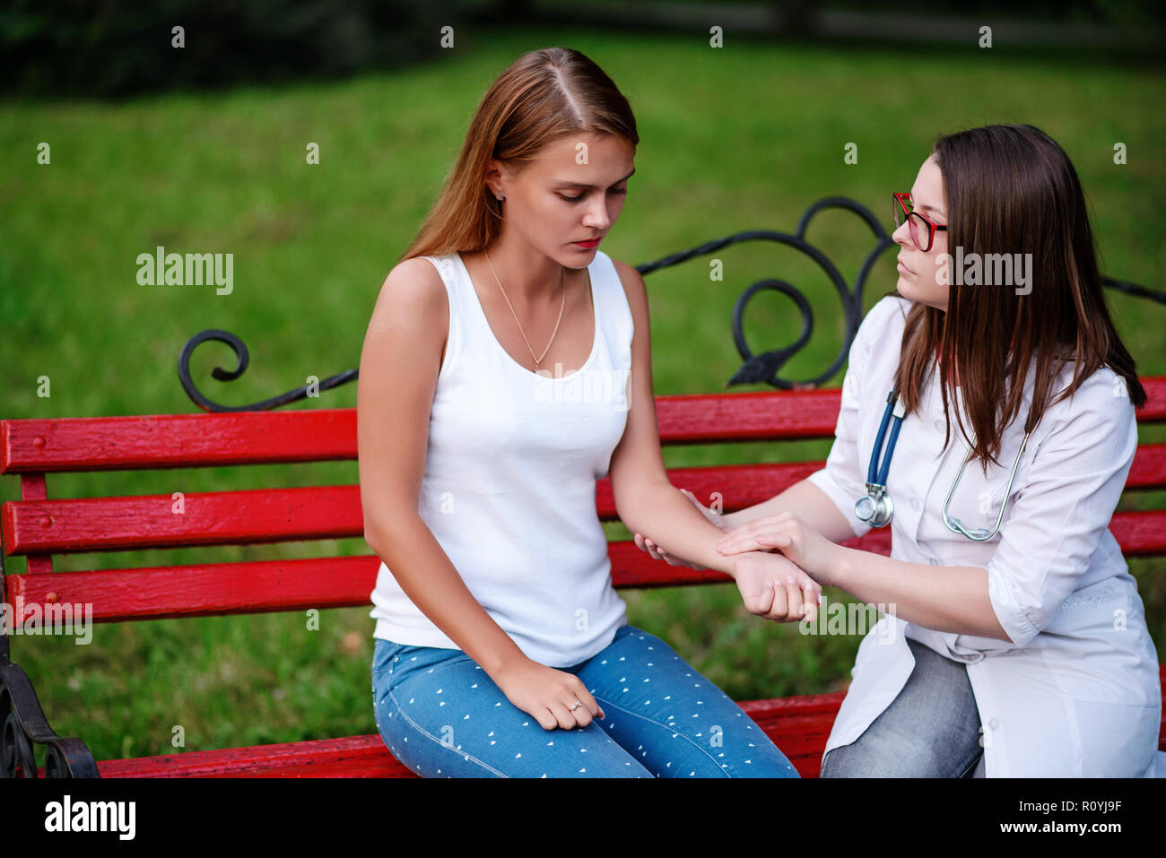 Medical doctor sitting on bench hi-res stock photography and images - Alamy