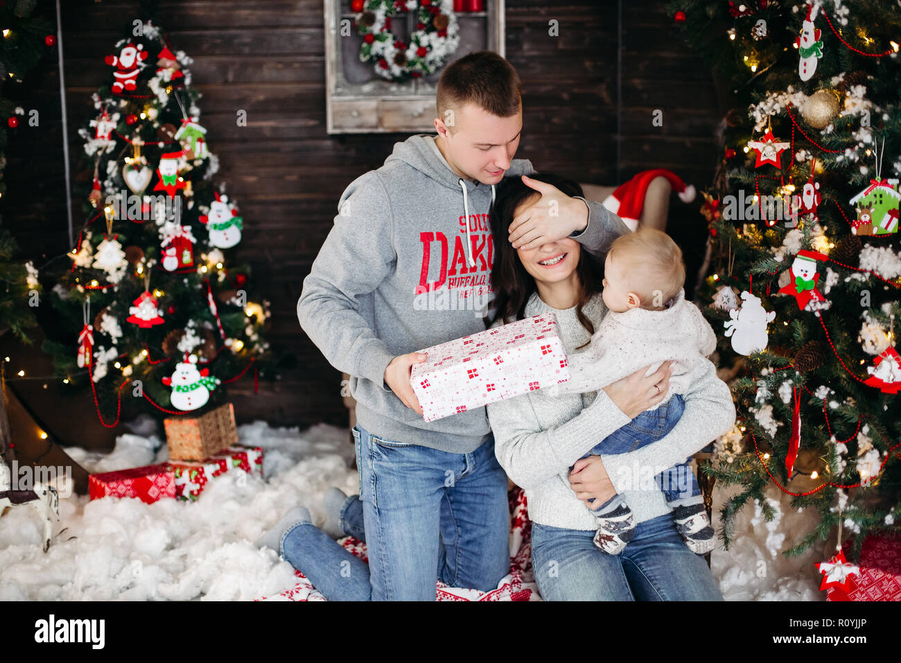 Happy family opening christmas presents with children Stock Photo - Alamy