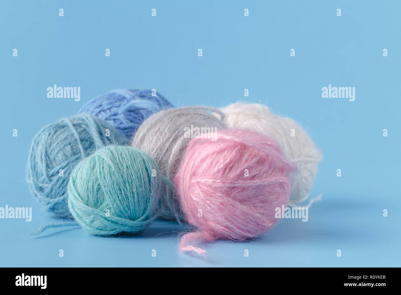 Balls of pink and blue yarn Stock Photo - Alamy