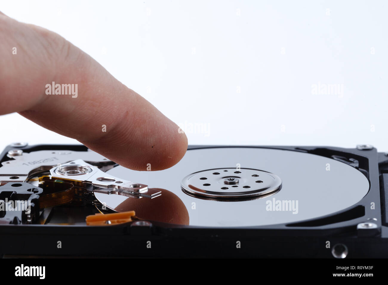 Repairing hard drive Hdd, touching it hands Stock Photo - Alamy