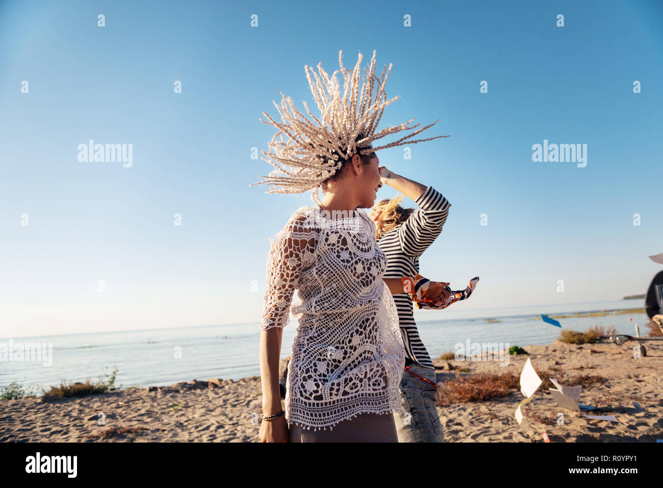 Woman with white dreadlocks dancing with her man near the river Stock ...