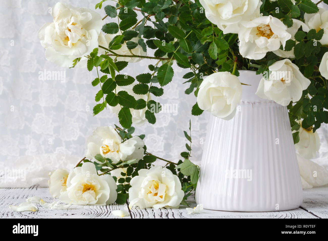 Beautiful rose in vase on wooden window Stock Photo - Alamy