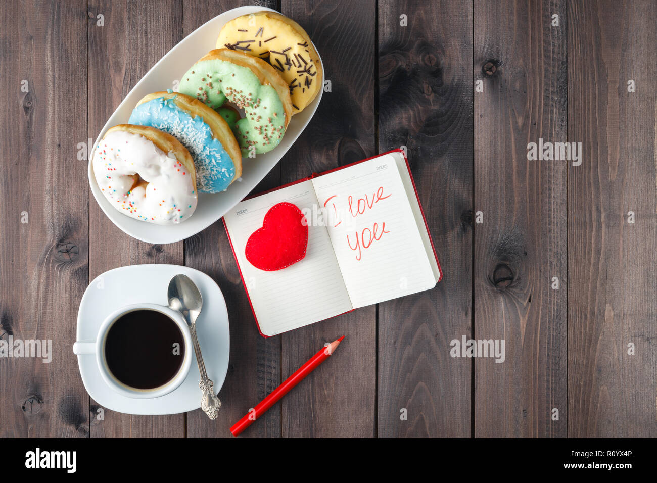Romantic breakfast. Donuts with coffee and message i love you Stock ...