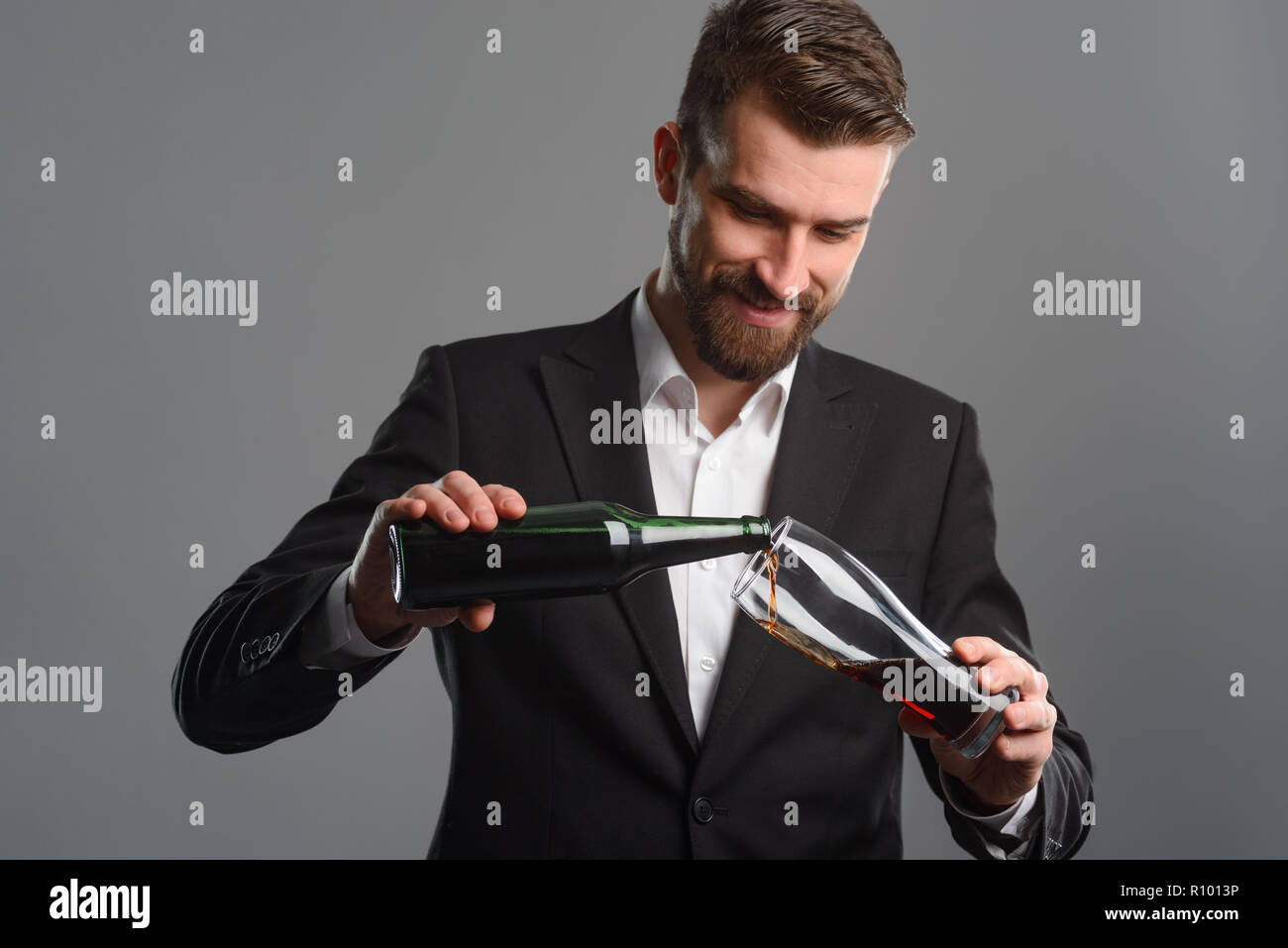 Man filling glass with beer Stock Photo - Alamy