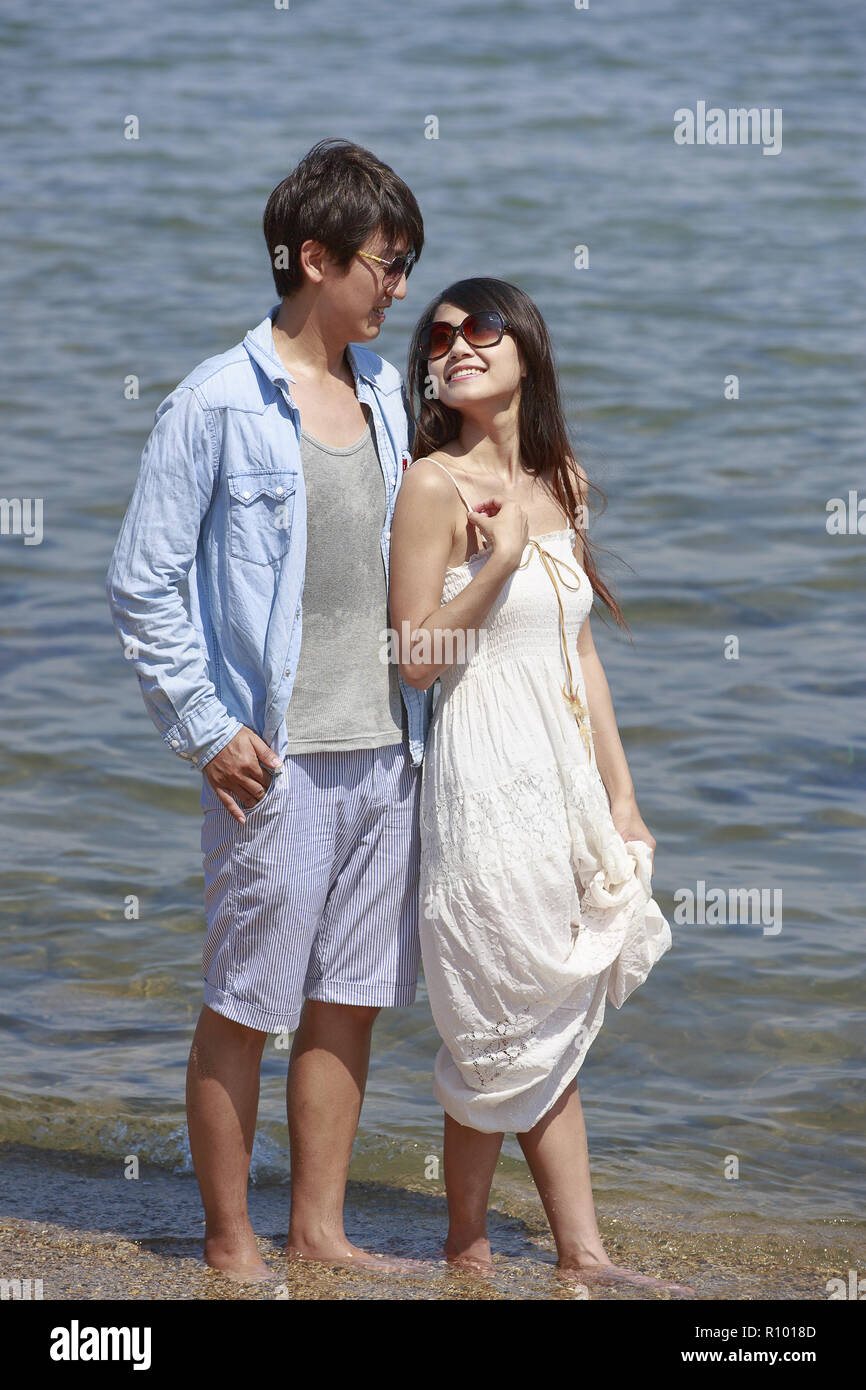 couple by the sea Stock Photo - Alamy