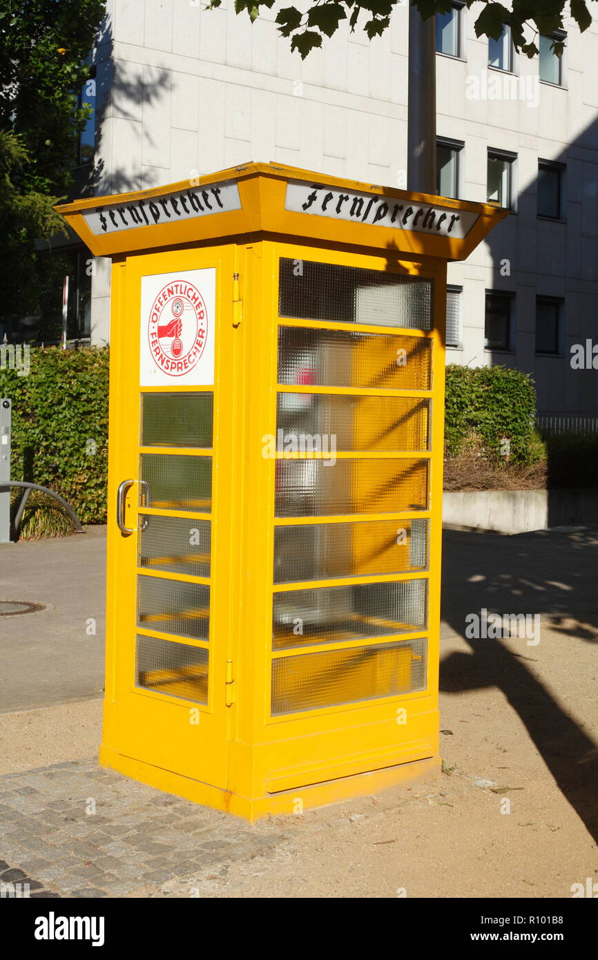 Yellow telephone box hi-res stock photography and images - Alamy