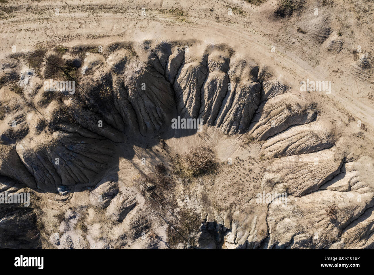 Surrealistic aerial image of abandoned opencast mine. Bad land pattern ...