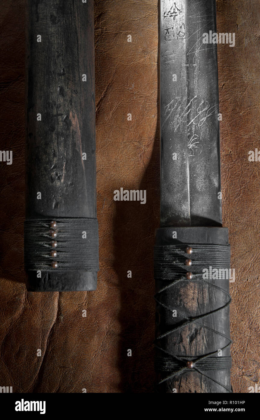 Part of hidden in the stick Real japanese samurai sword on brown ...