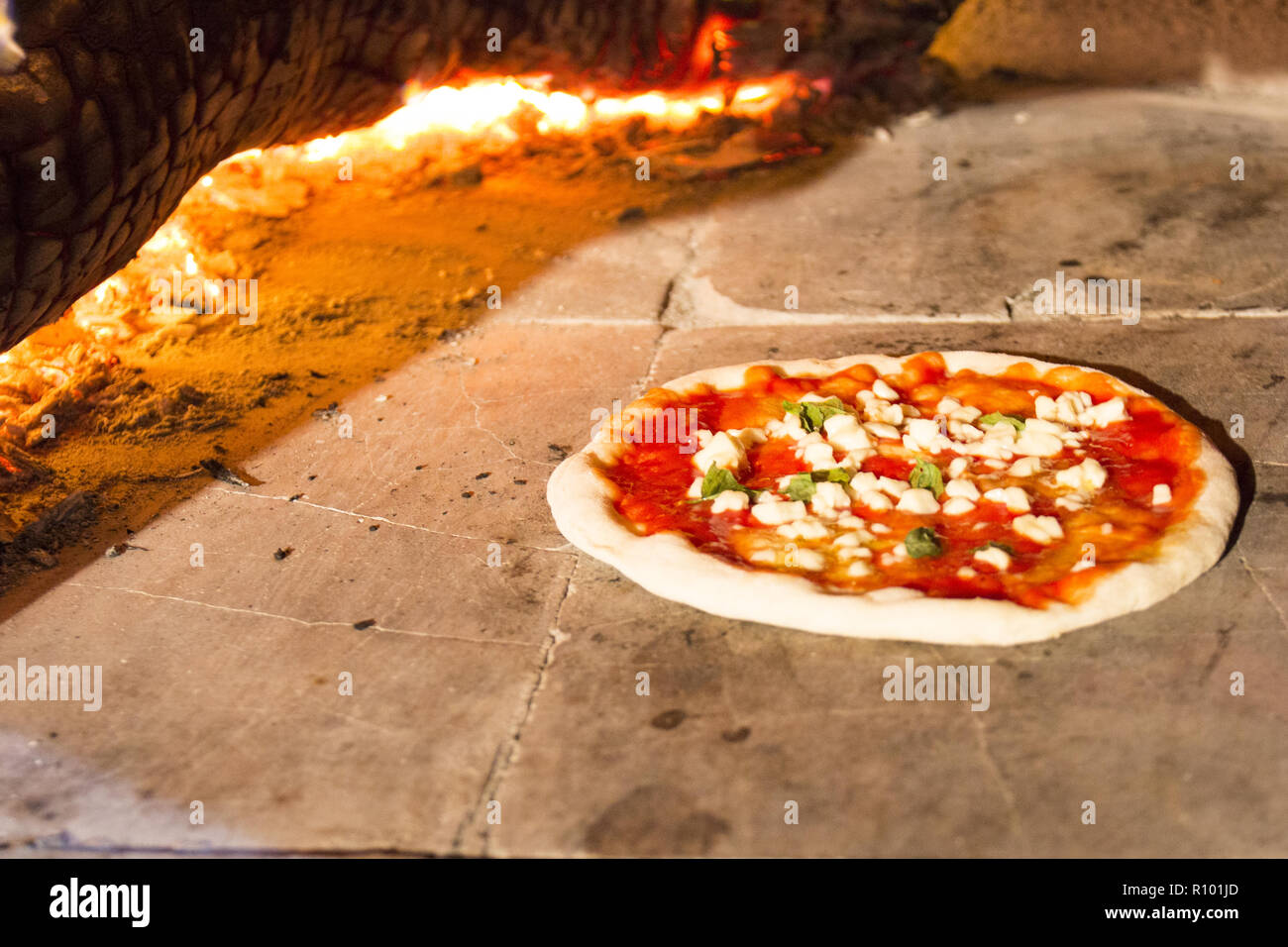 Pizza in a wood oven, pizzeria, Italian food Stock Photo - Alamy