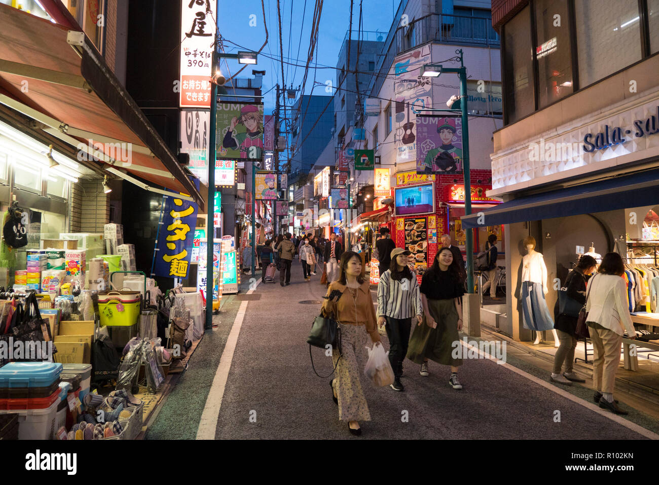 People walk the narrow streets of Shimo-Kitzawa in Tokyo, Japan Stock ...