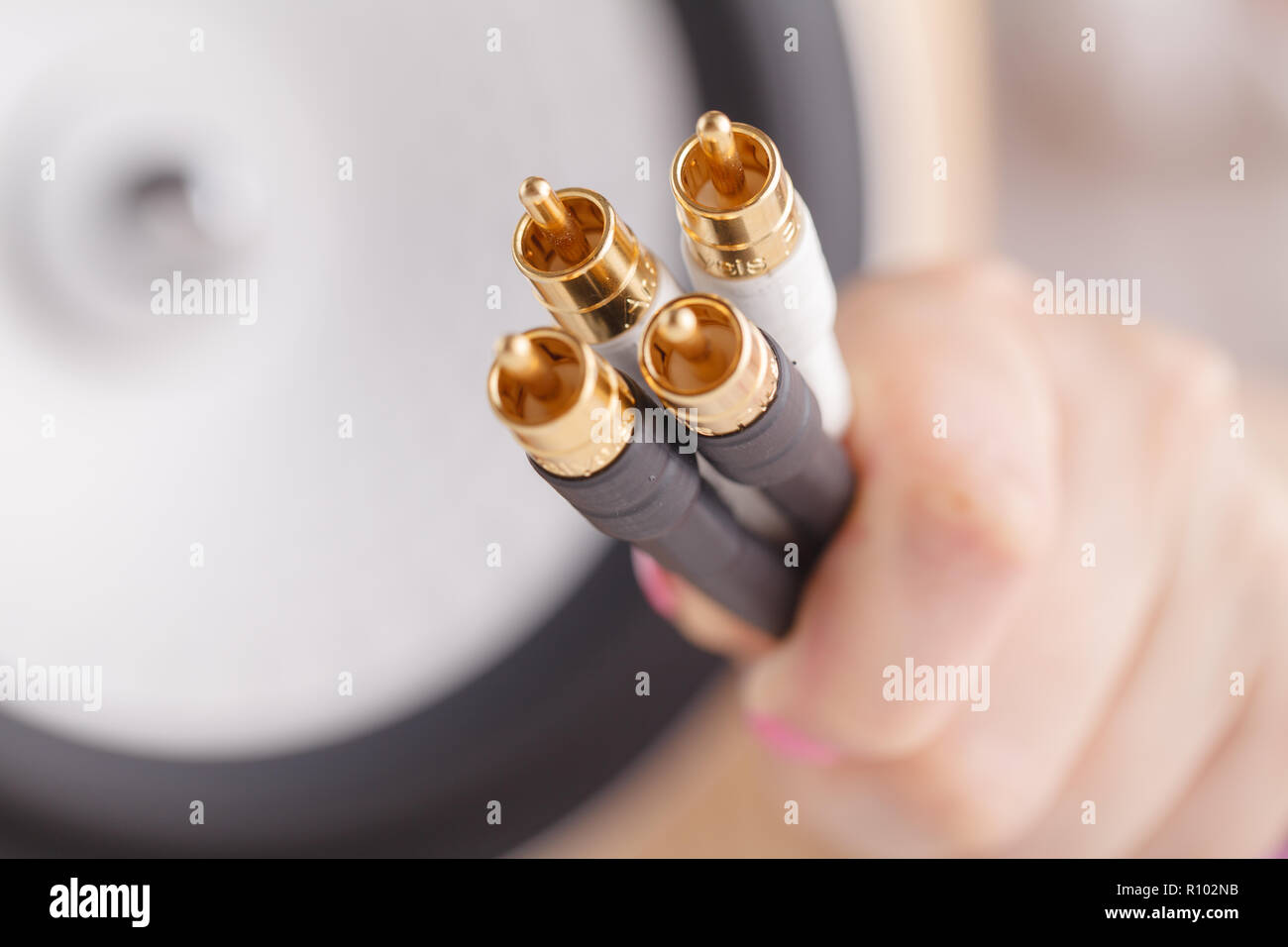 Hi-fi music cable in female hands Stock Photo - Alamy