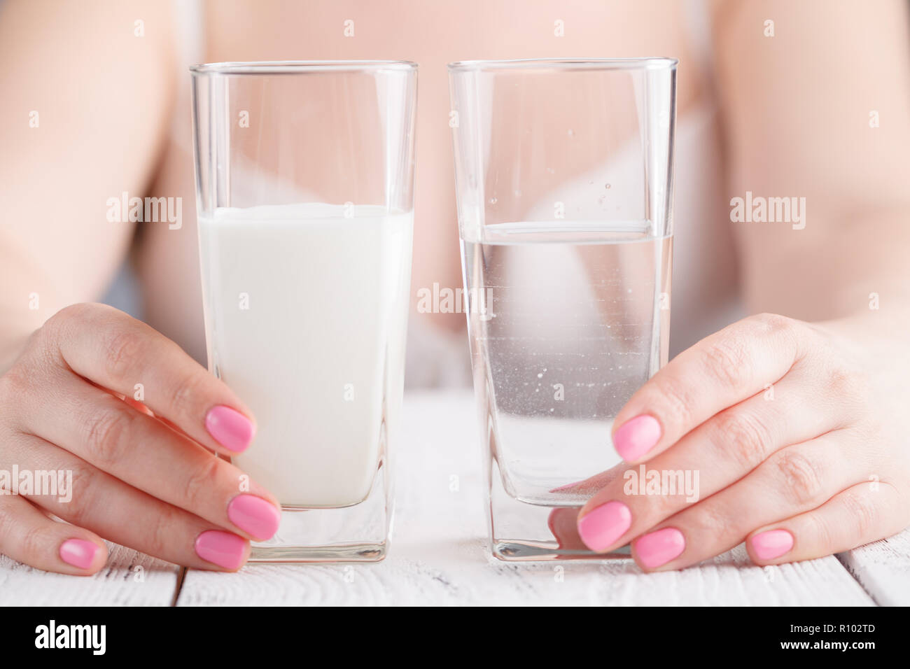 Glass of water and milk, side by side Stock Photo - Alamy