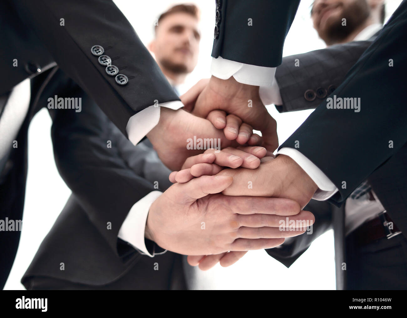 close up.business team adding a tower of hands Stock Photo - Alamy