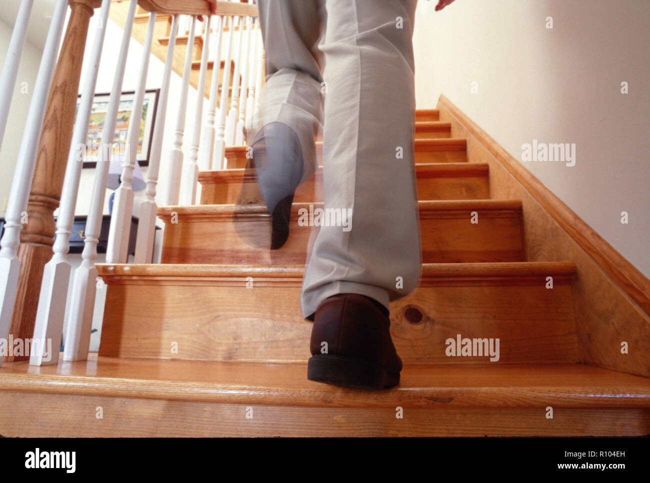 Man Walking Up Residential Flight of Stairs Stock Photo - Alamy