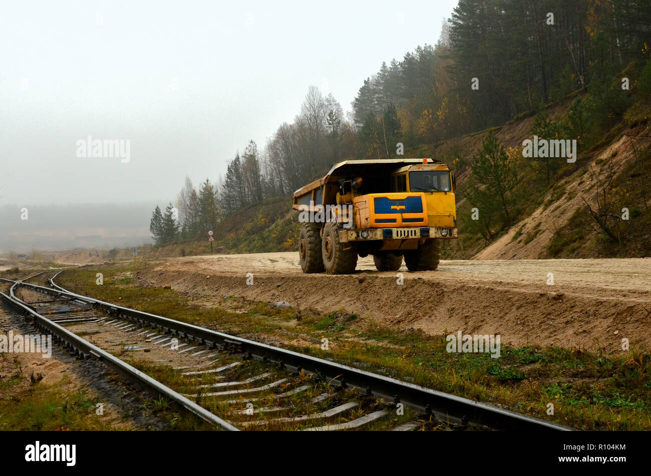 Heavy large quarry dump truck. Big wheels. The work of construction ...