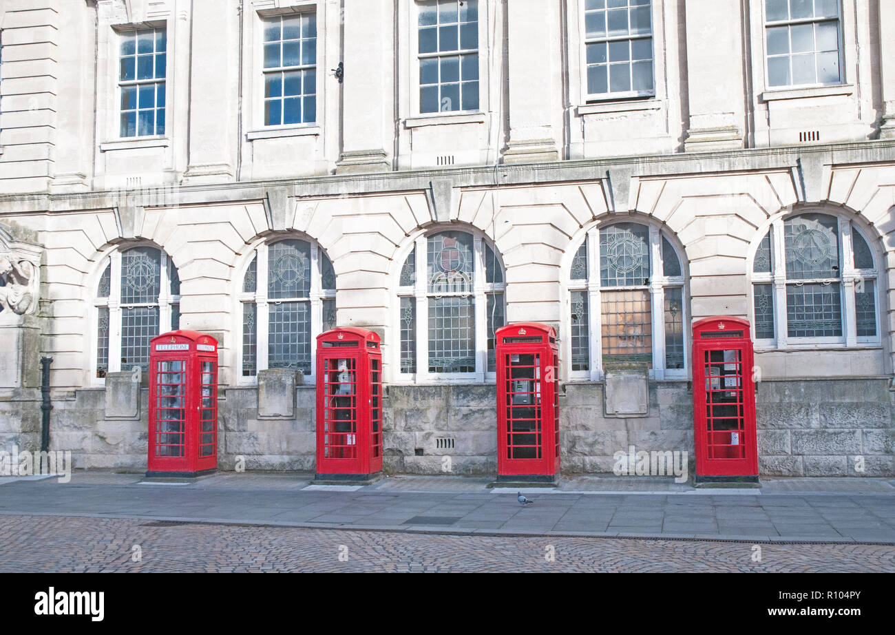 Row of four old style K2 phone boxes outside old General Post Office ...