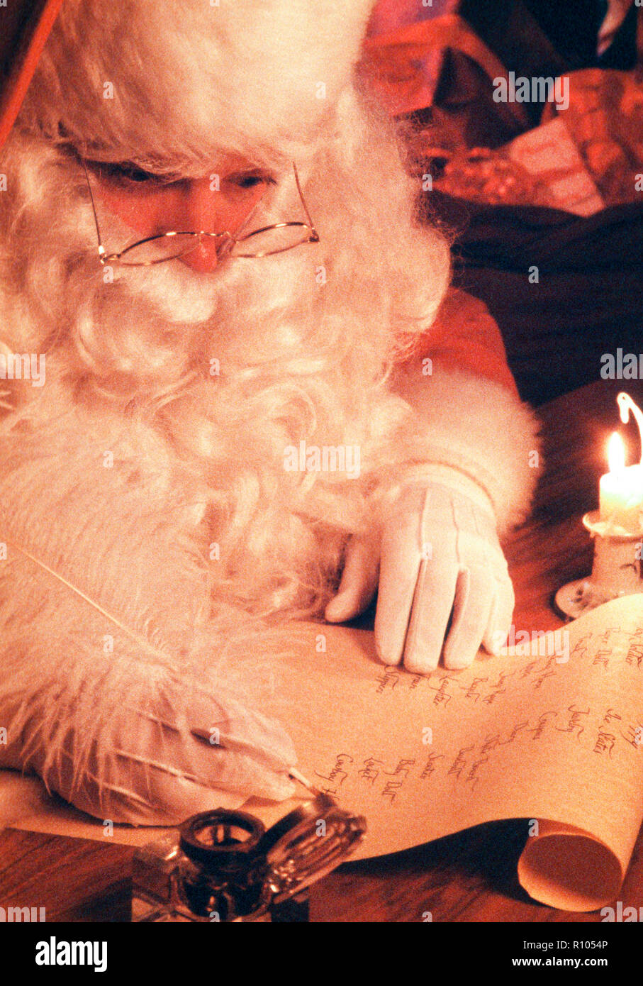 Santa Claus working on Naughty or Nice Gift List, USA Stock Photo - Alamy