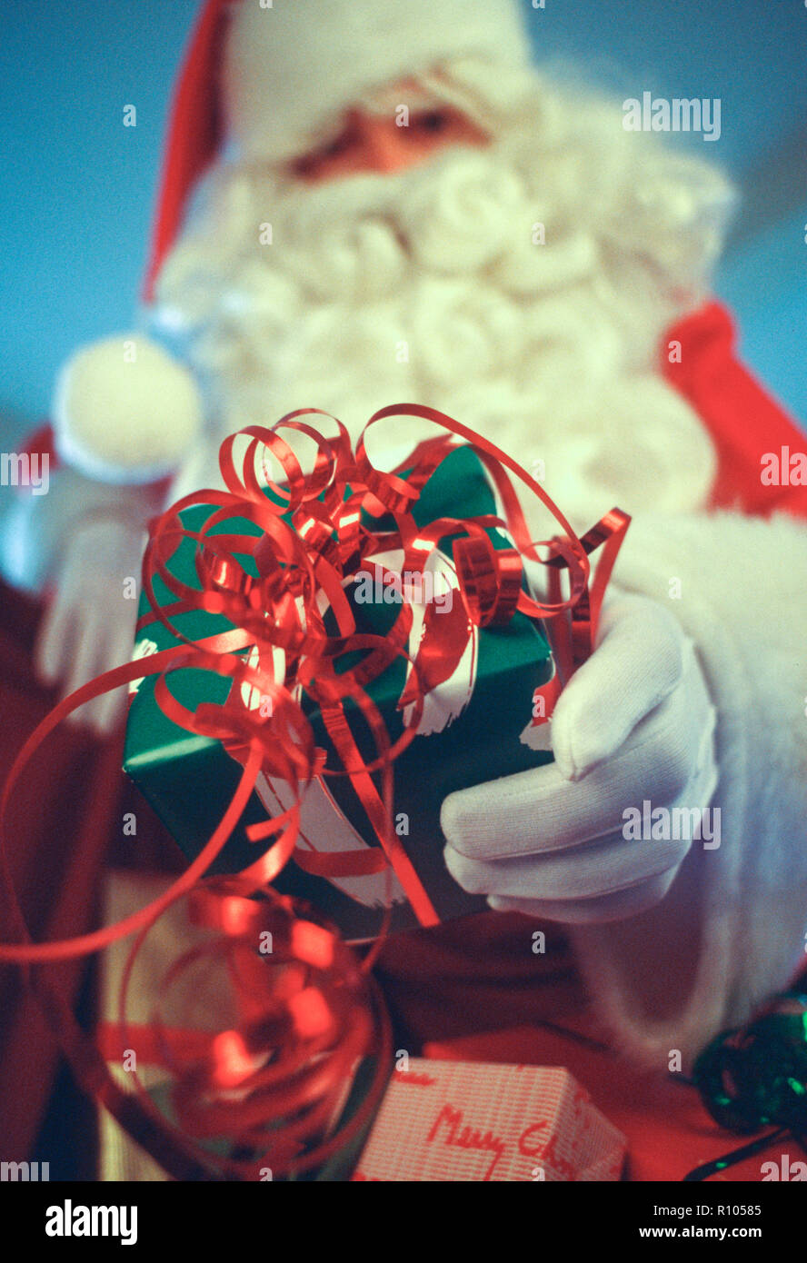 Santa claus distributing gifts hi-res stock photography and images - Alamy