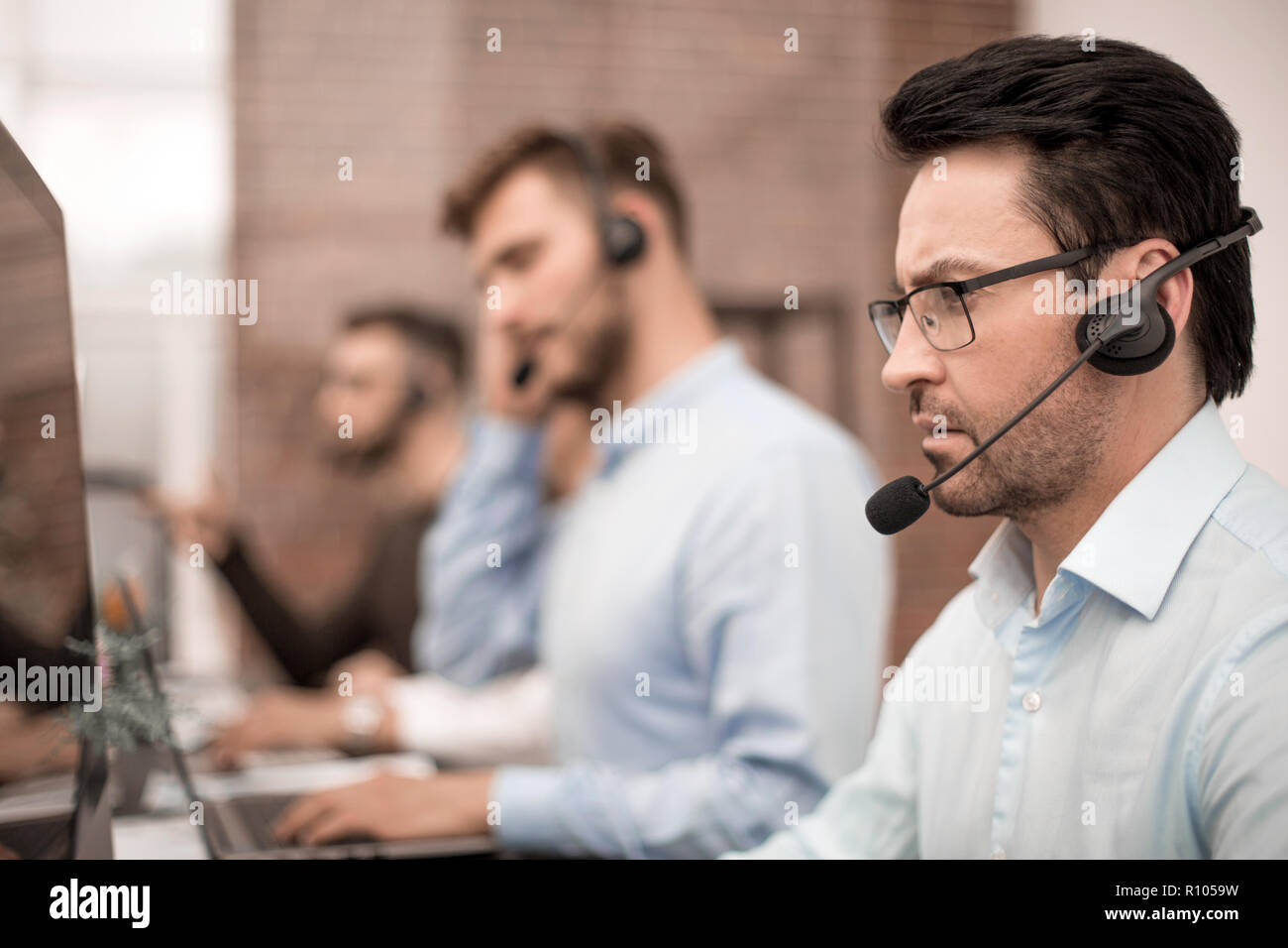 technical support specialist on the background of colleagues Stock ...