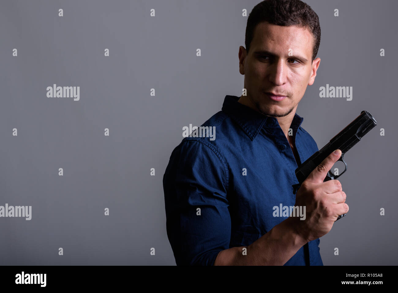 Person holding gun hi-res stock photography and images - Alamy