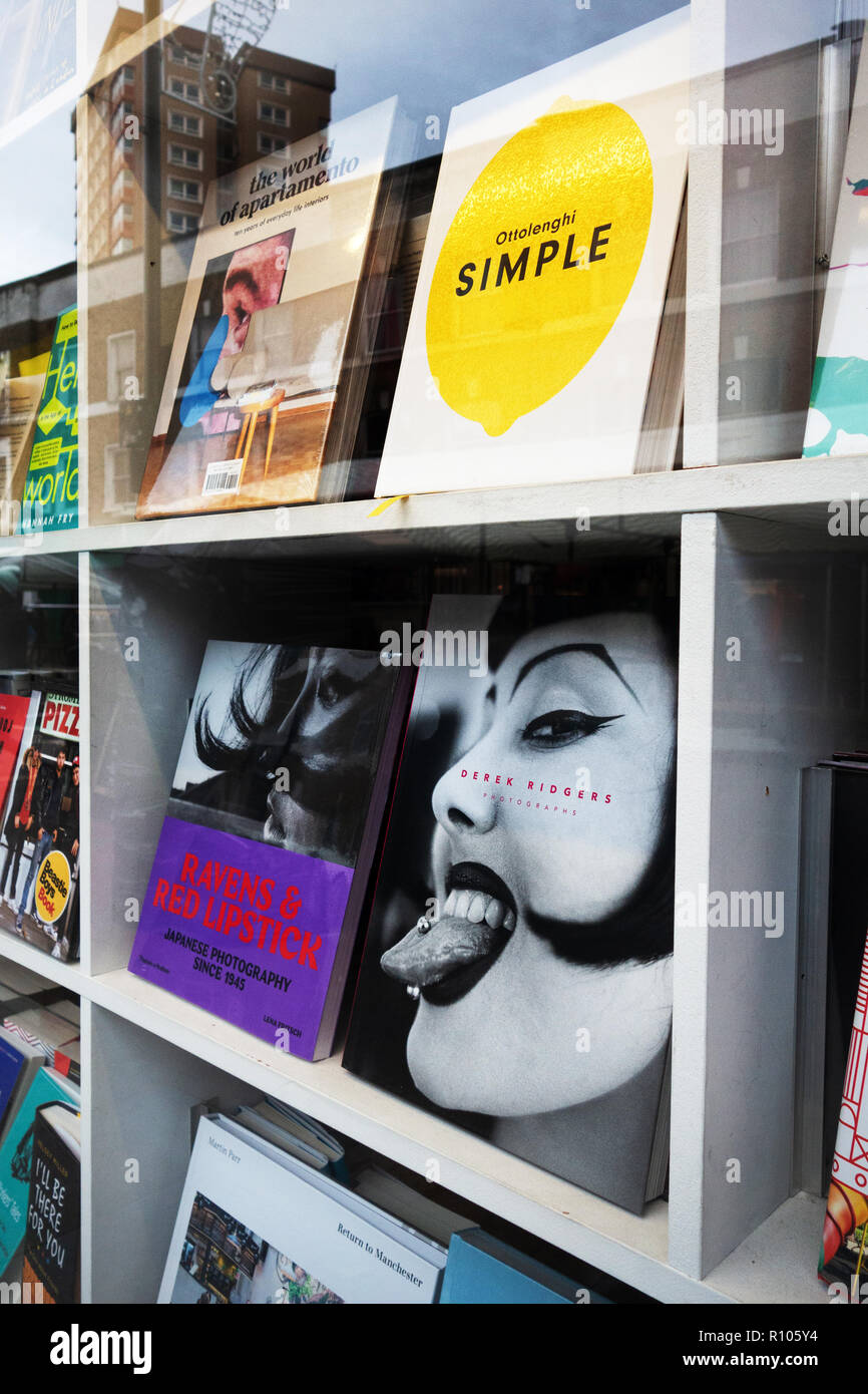 Collection of books on shelves in bookshop window Stock Photo - Alamy