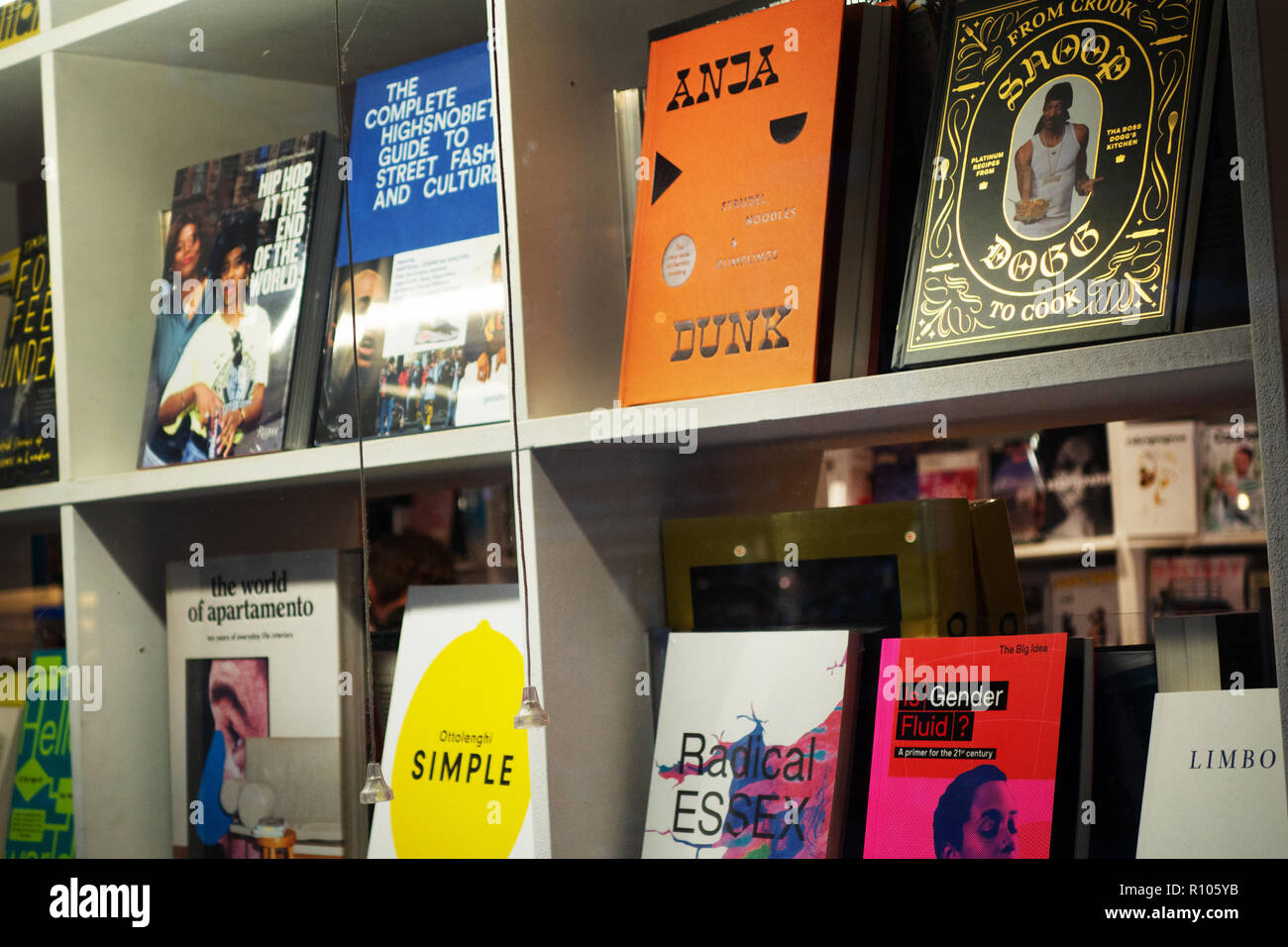 Collection of books on shelves in bookshop window Stock Photo - Alamy