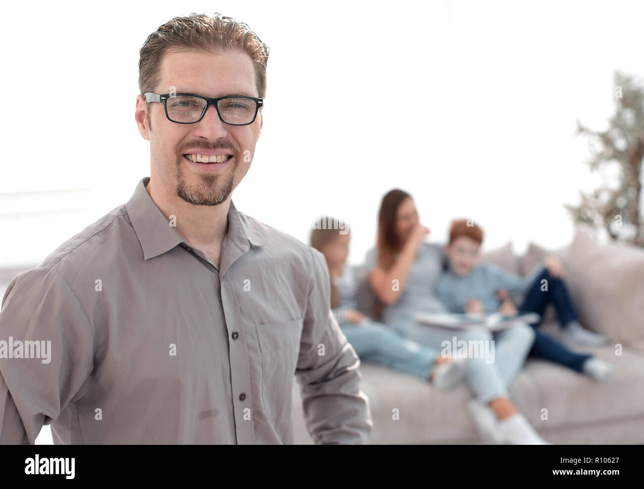 successful man standing in his living room Stock Photo - Alamy