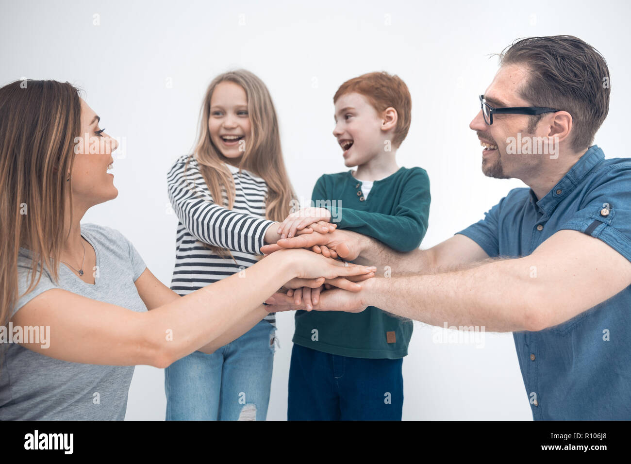 happy family showing their unity Stock Photo - Alamy