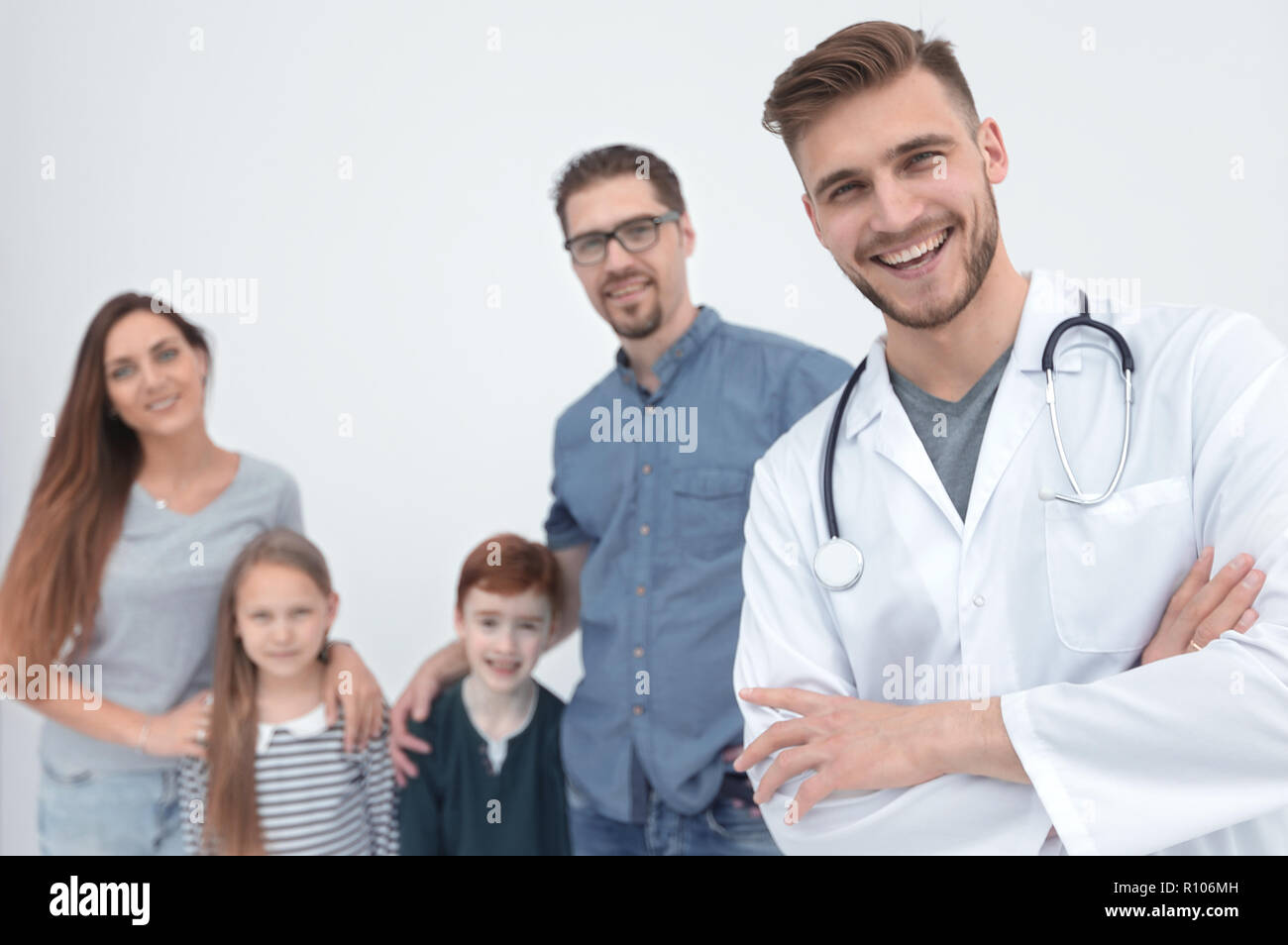 smiling family doctor and his patients Stock Photo - Alamy
