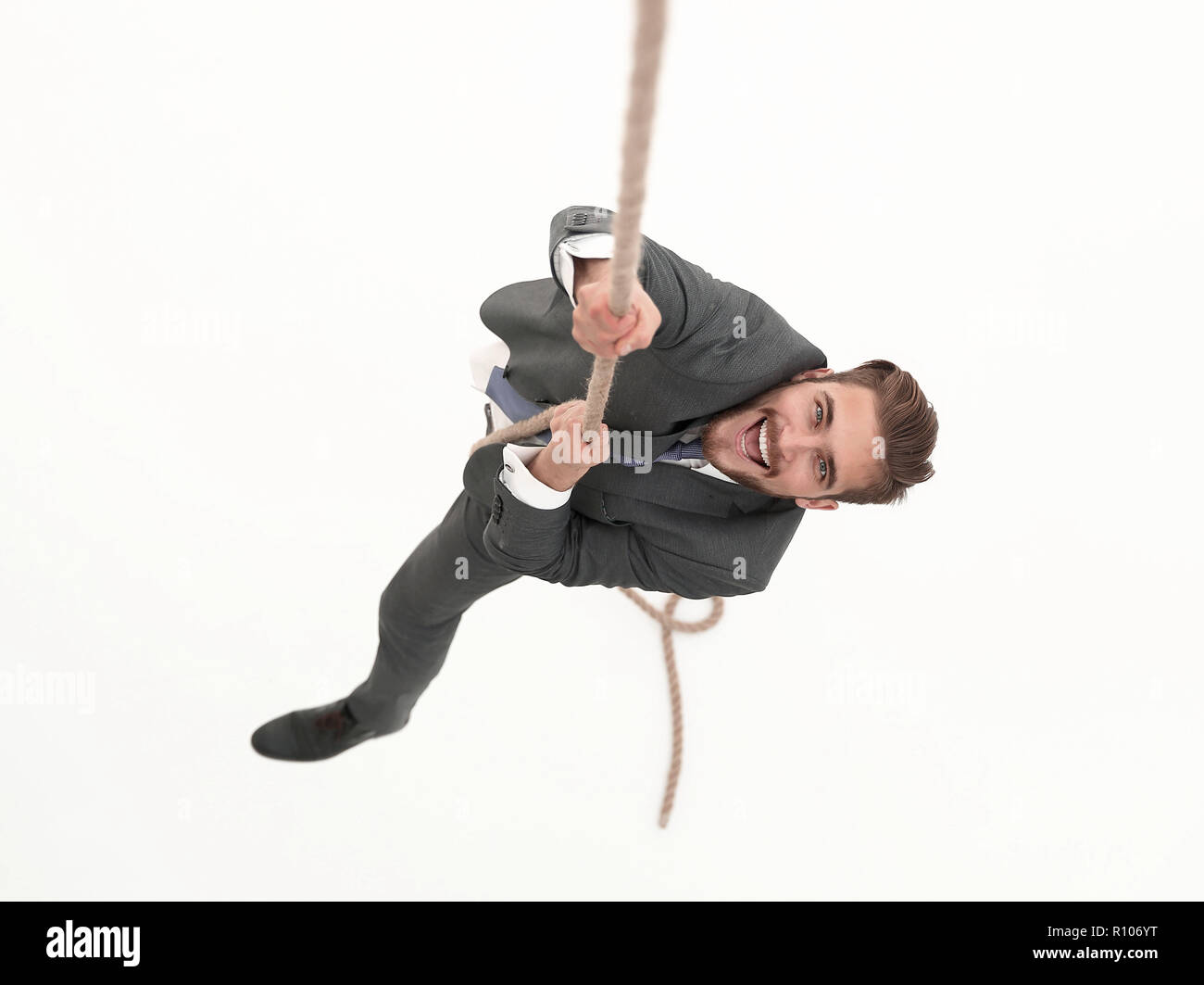 successful businessman climbing the rope Stock Photo - Alamy