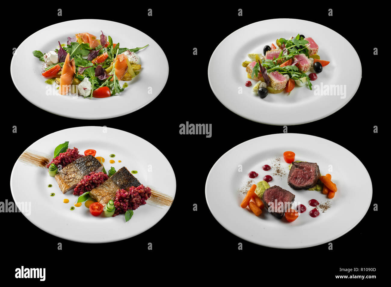 Set of prepared food on dishes on a black background Stock Photo - Alamy