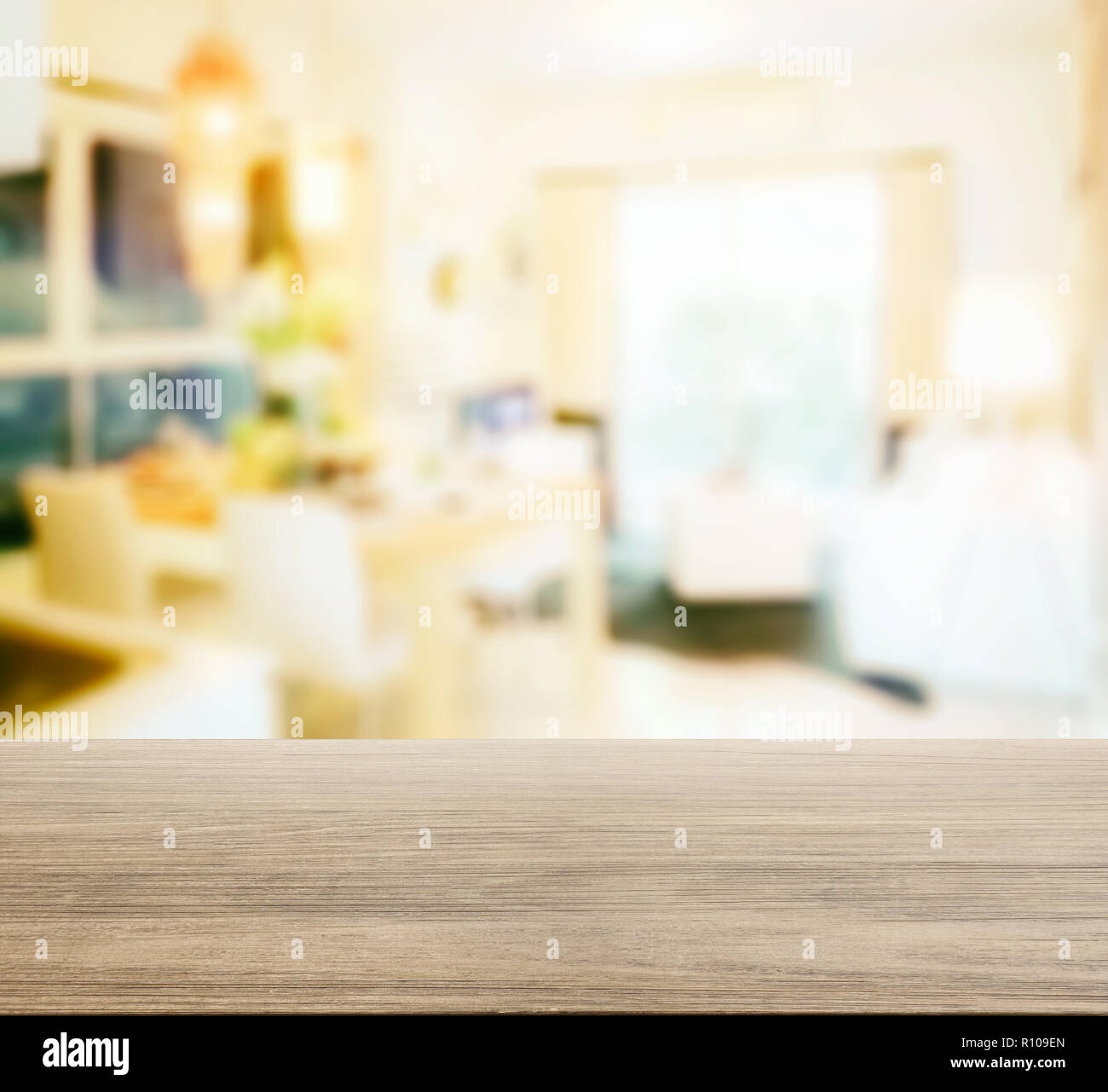 wooden table top with blur of dining table in modern dining room ...
