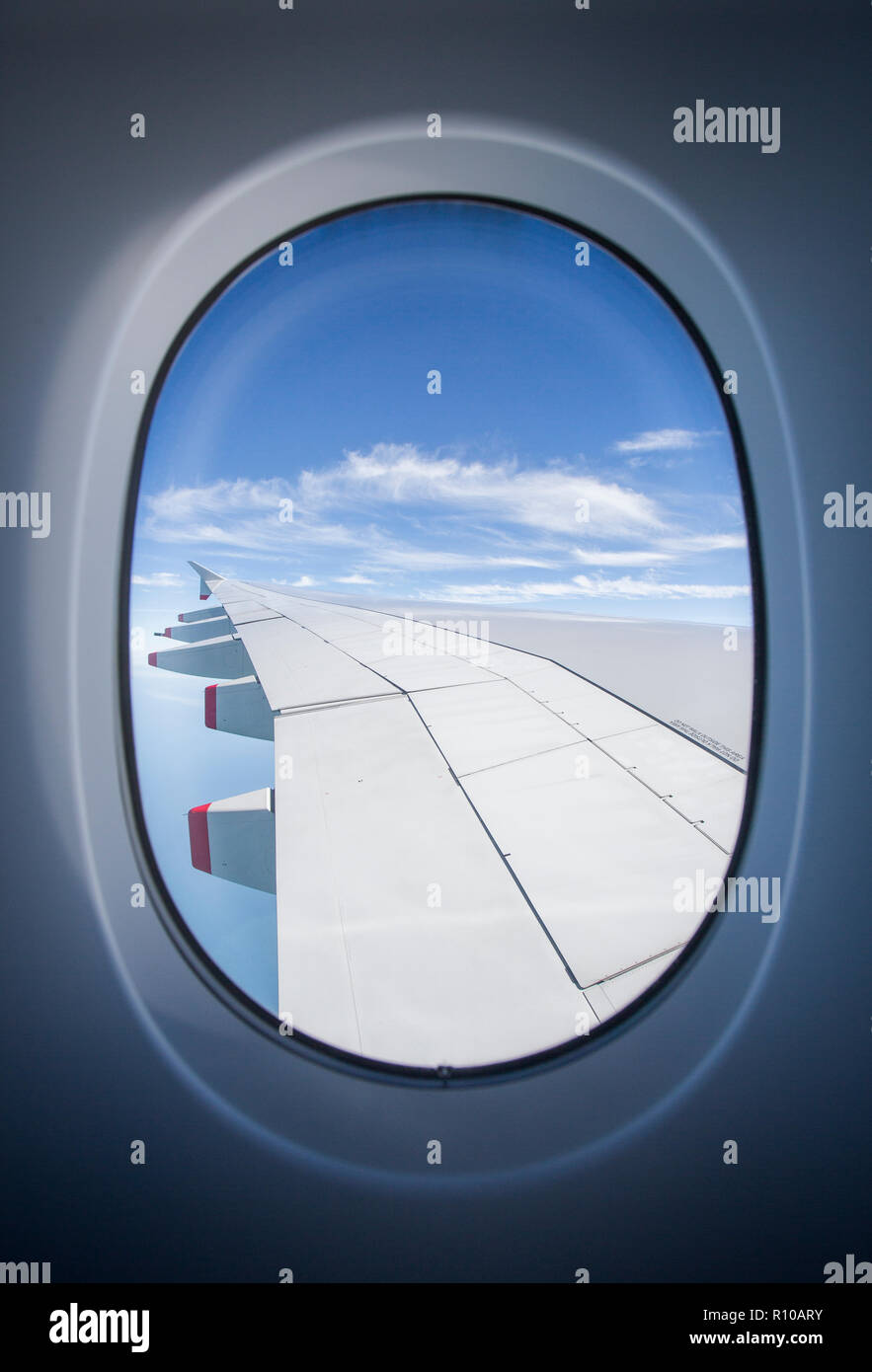 view out of a plane window mid flight looking over dubai Stock Photo ...
