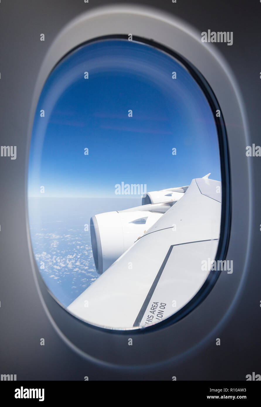 view out of a plane window mid flight looking over dubai Stock Photo ...