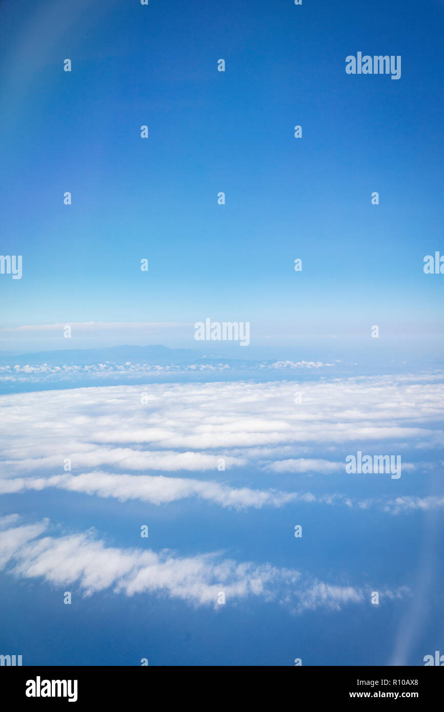view out of a plane window mid flight looking over dubai Stock Photo ...