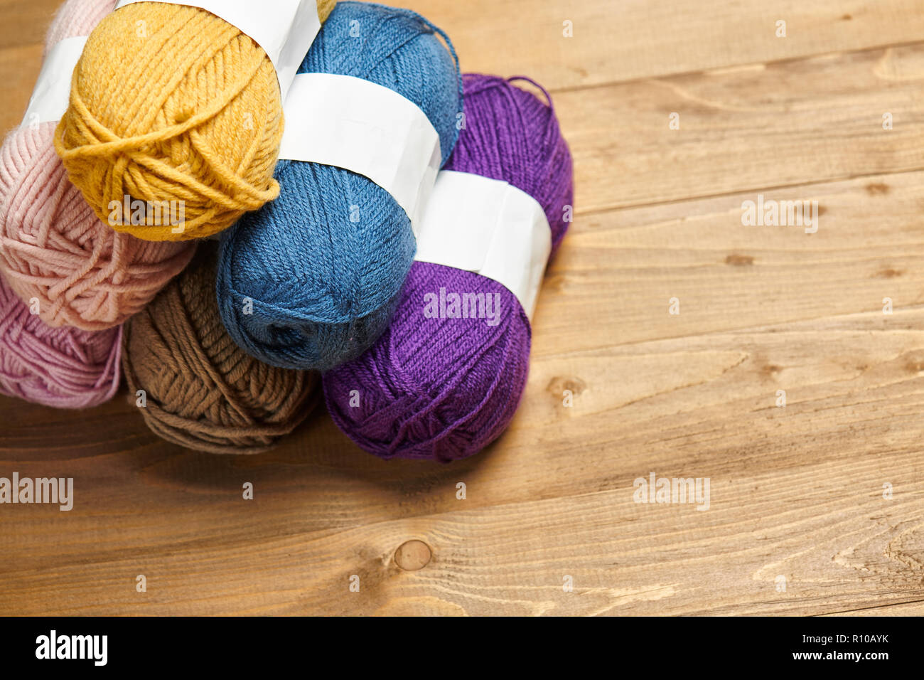 Yellow ball of yarn with blue label hi-res stock photography and images ...