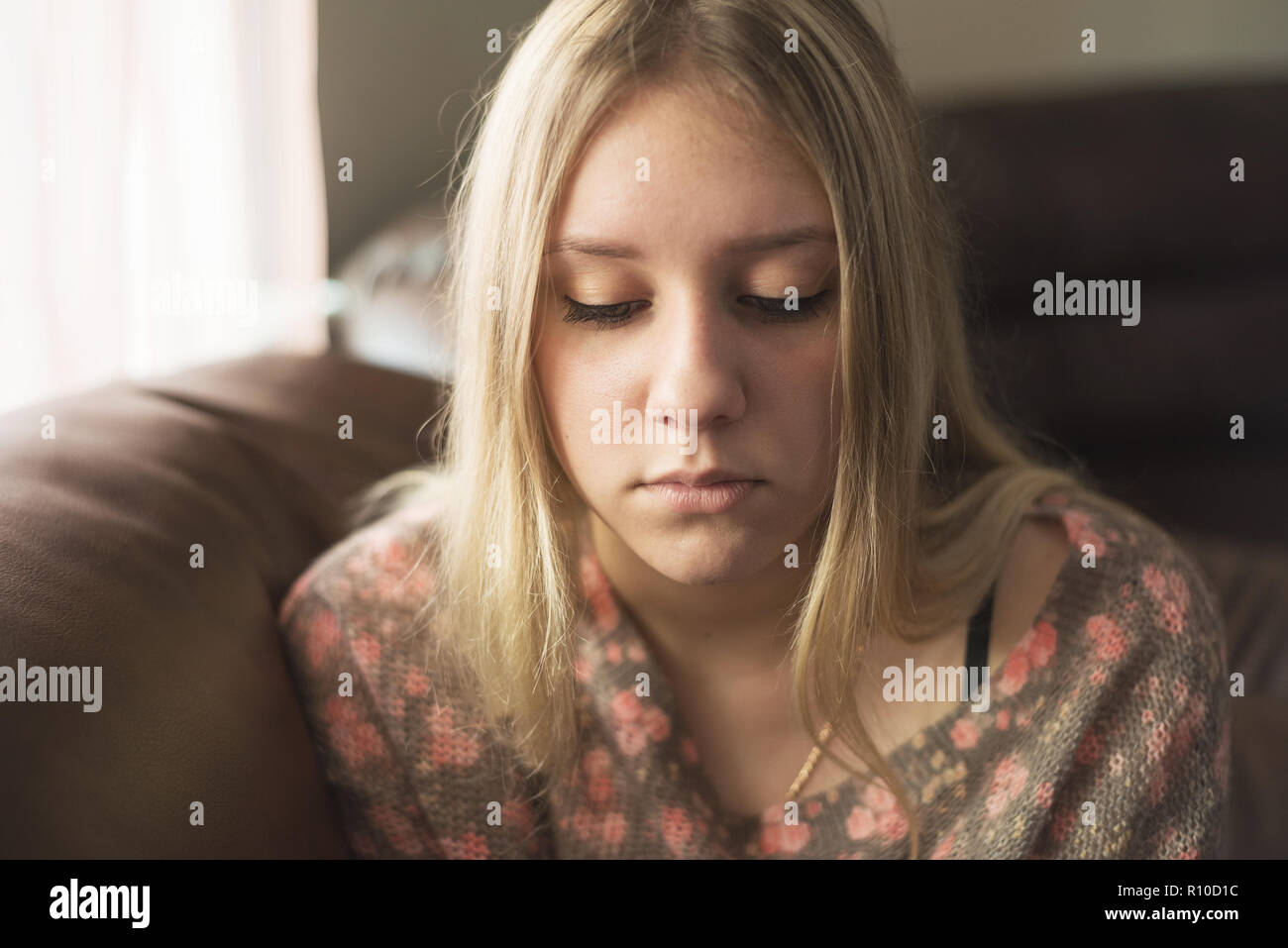 Portrait of a sad teen girl Stock Photo - Alamy