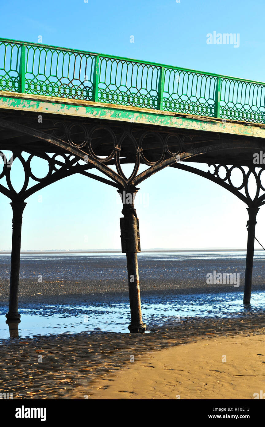 Leaning iron leg supports underneath seaside pier Stock Photo - Alamy