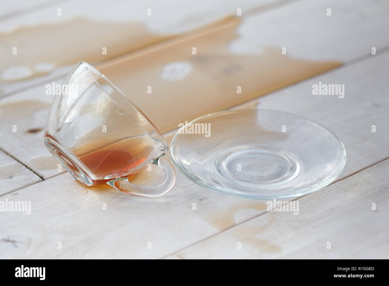 Drop cup tea by accident Stock Photo - Alamy