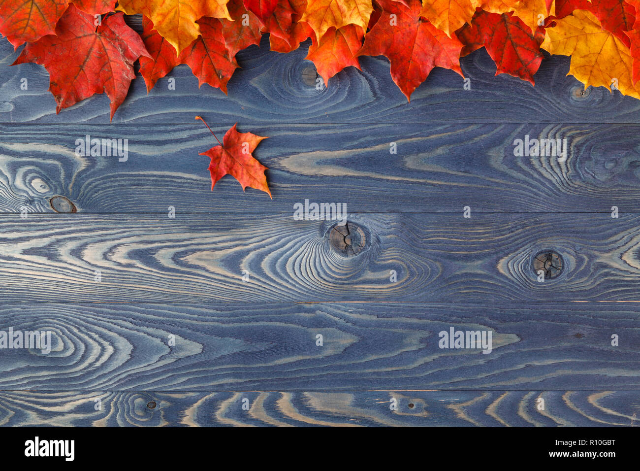 Autumn leaves over wooden background with copy space Stock Photo - Alamy