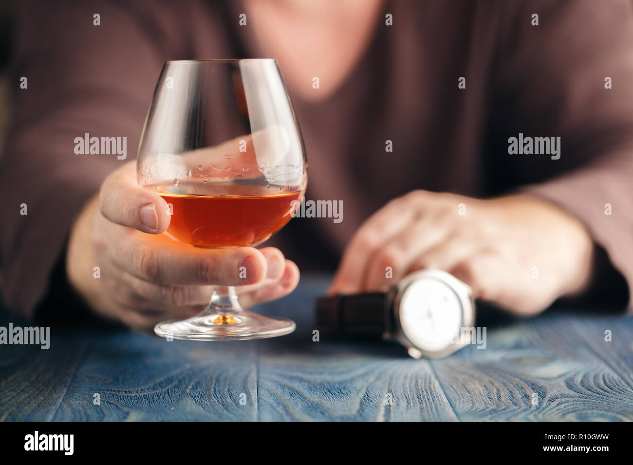 Alcohol abuse, alone man drink whisky for relax Stock Photo - Alamy